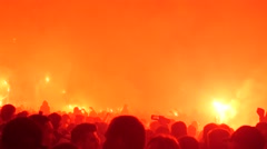 Football ultras Fans supporters burn flares. Riots on the street ...